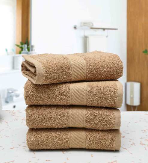 Buy Beige Solid 400 GSM Cotton Hand Towels (Set of 4) by RANGOLI Online ...