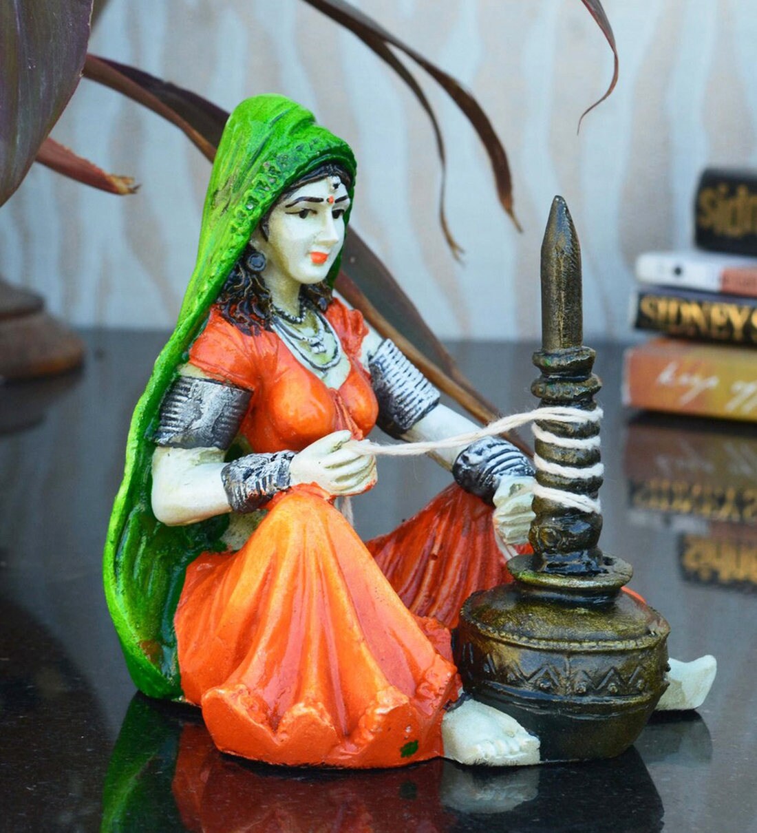 Buy Orange Rajasthani Lady Using Makhan Handi at 63% OFF by eCraftIndia ...