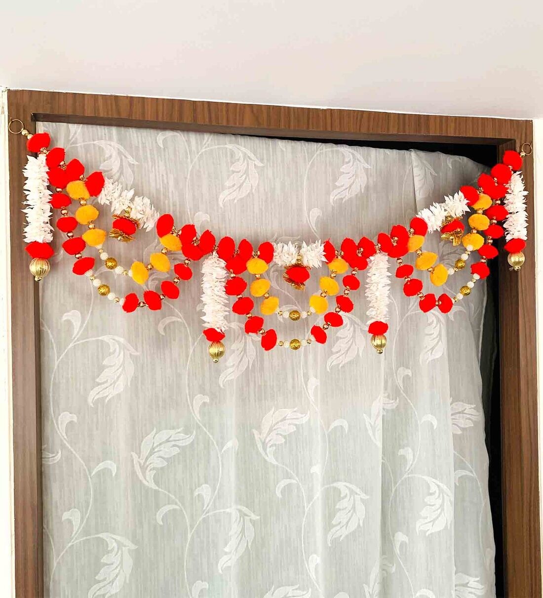 Buy Red And Yellow Gonda With White Flower Toran by Suriti The culture ...